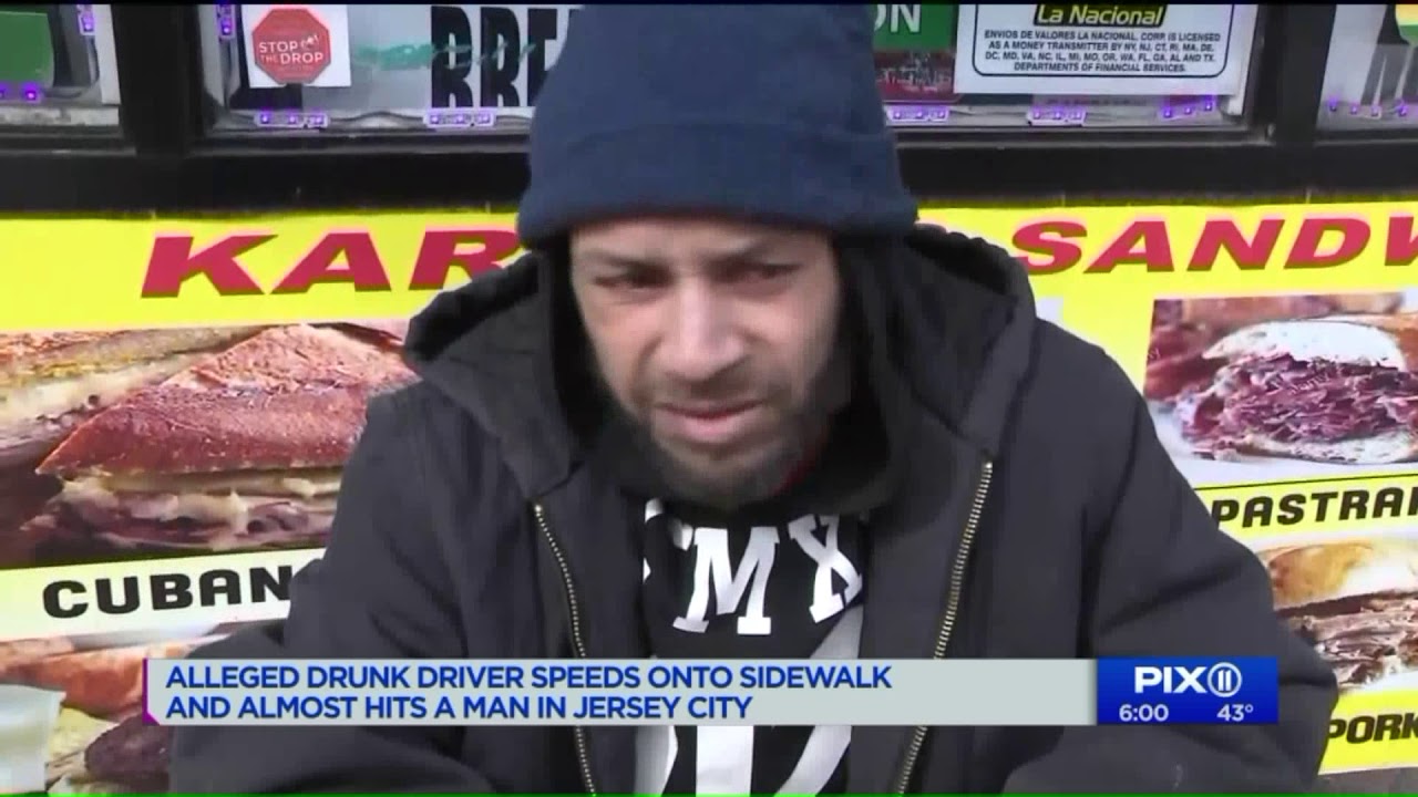 Alleged drunk driver speeds onto sidewalk in Jersey City, nearly ...