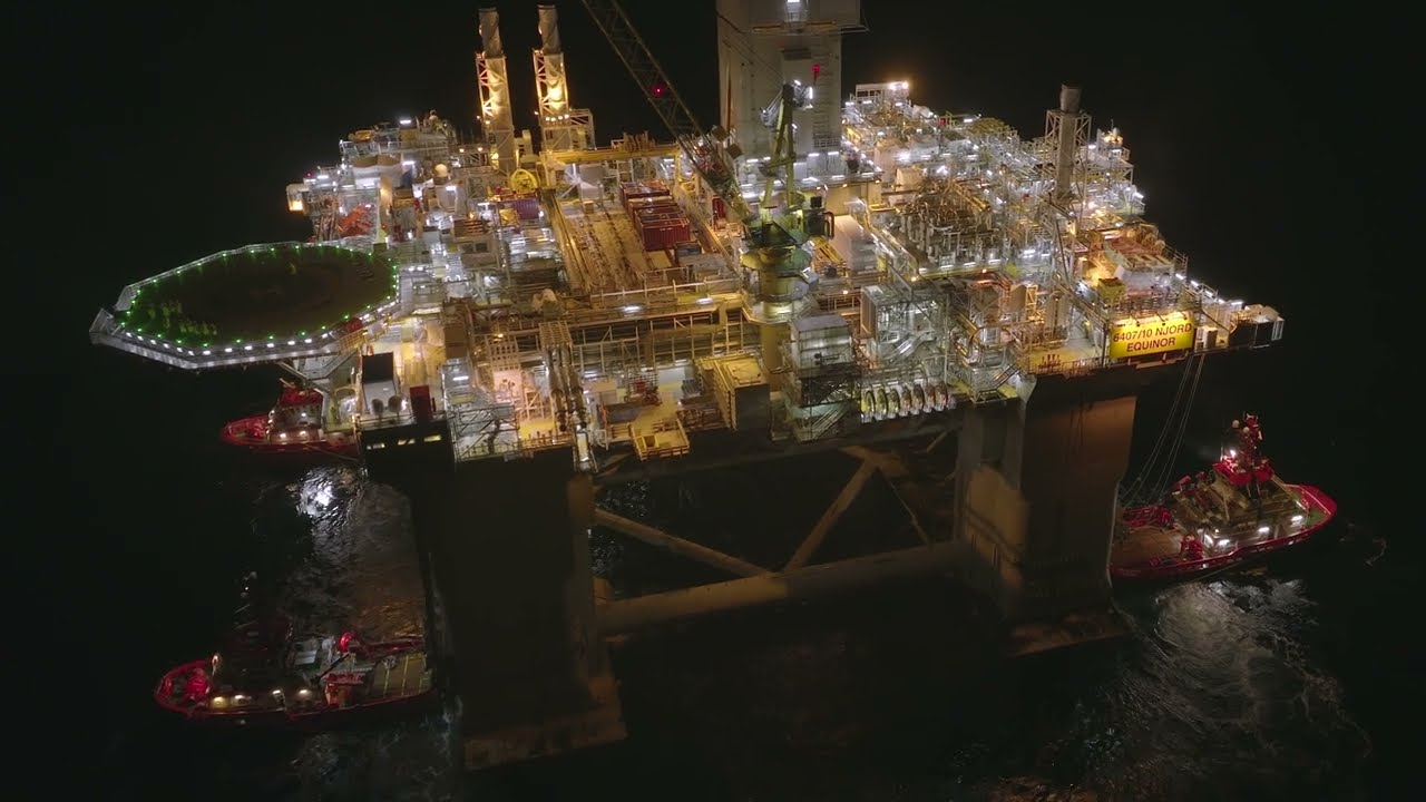 The floating steel platform, Njord A, leaves quay at night | DJI Mavic ...