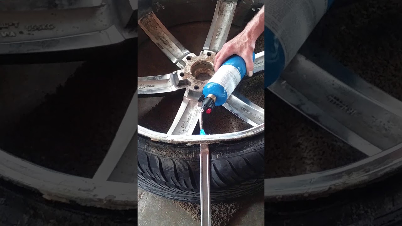 Fixing my bent 26 inch rim with 25$ blow torch, tire pry bar ...