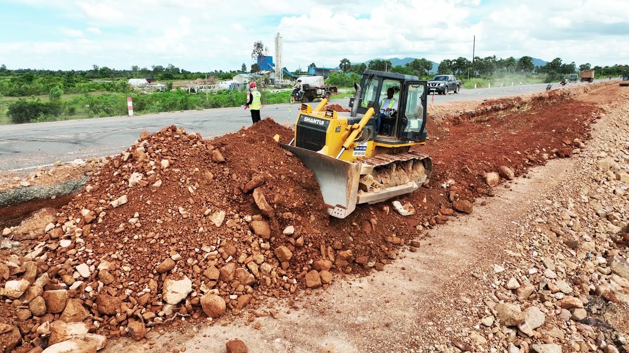 The Operator Strategically Maneuvers The Bulldozer to Push the ...
