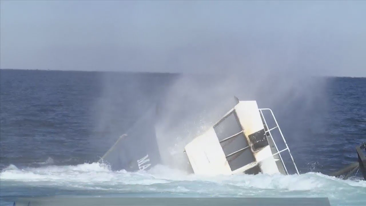 Destin officials sink 180-foot ship to create artificial reef - YouTube