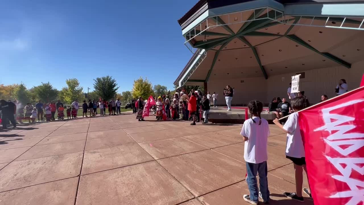 People gather at the Memorial Park Bandshell ahead of the NDN ...