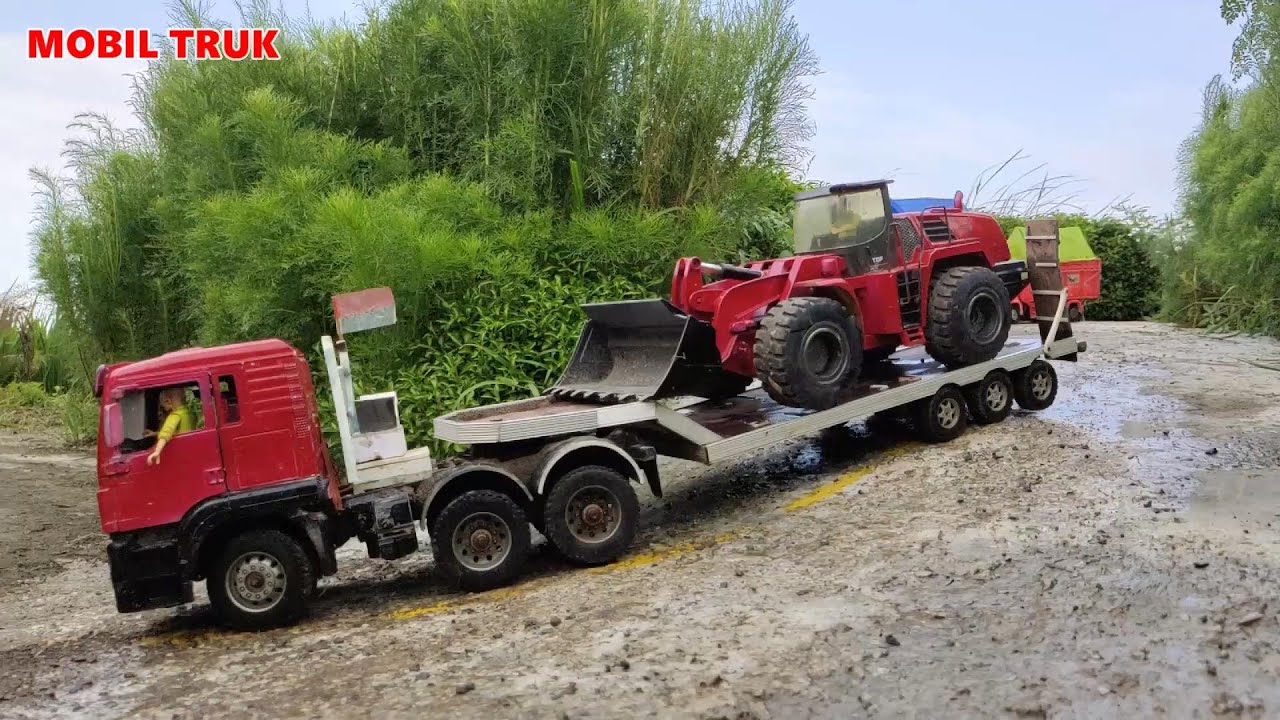 MOBIL TRUK KONTAINER PANJANG MUAT LOADER, TRUCK OLENG MELEWATI LUMPUR ...