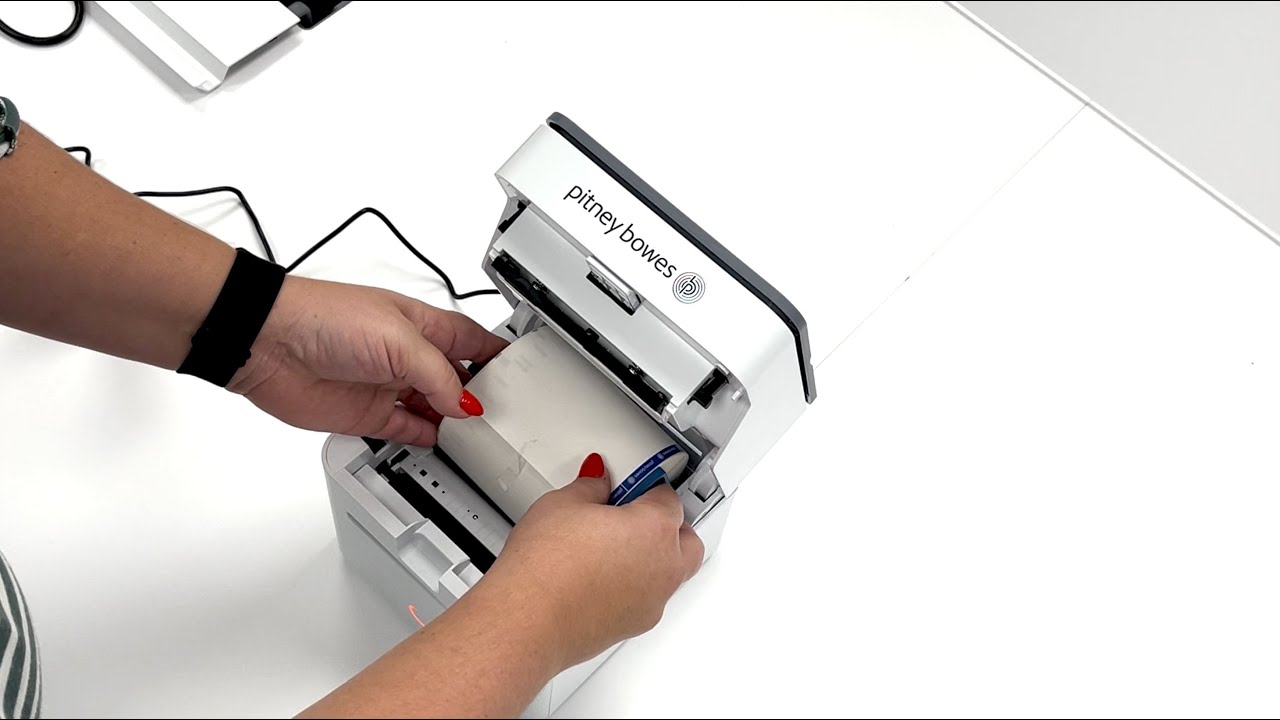 Changing the label roll on the PitneyShip Cube - YouTube