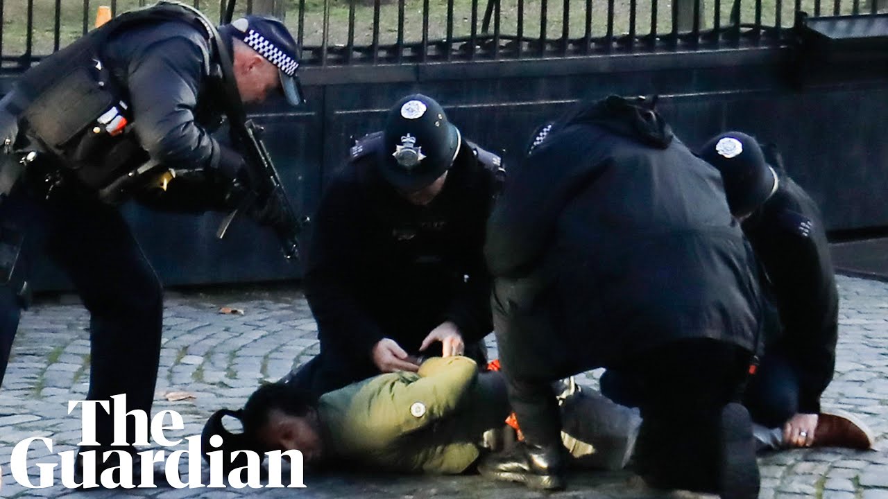 Armed police detain man after incident at parliament - YouTube
