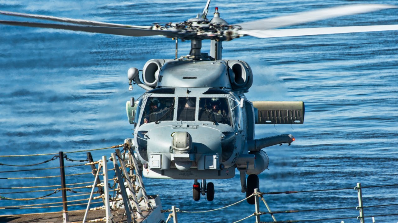 Sea Hawk Helicopter Takes off From The Flight Deck of a Guided Missile ...