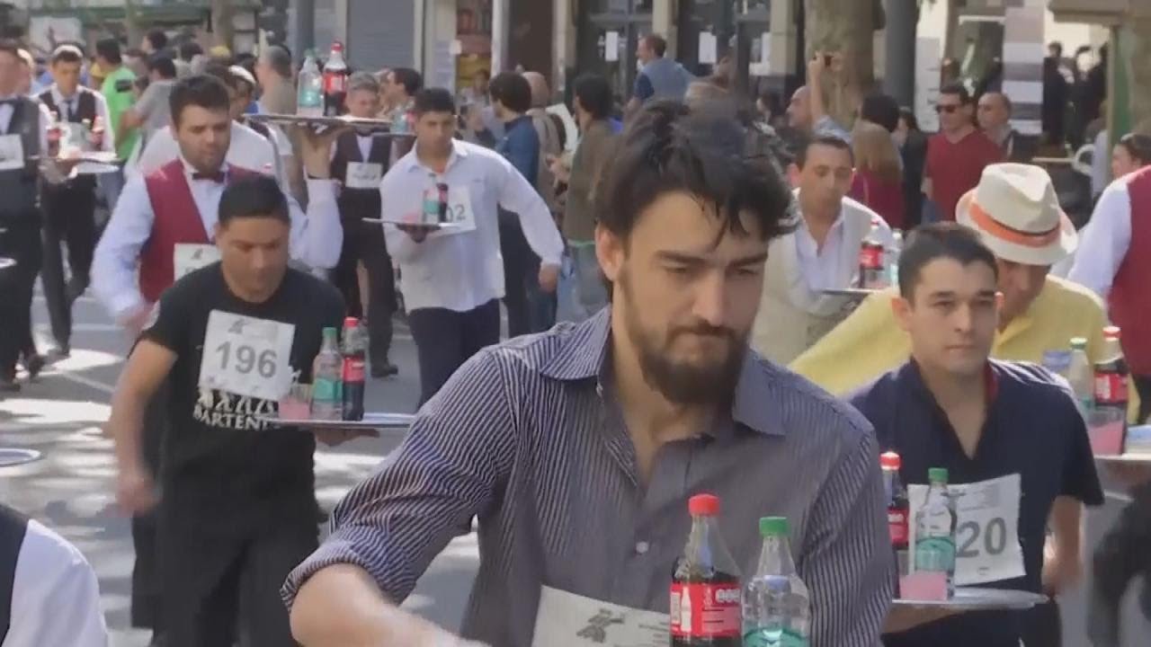 Hundreds of Waiters Race Through the Streets in Awkward Competition ...