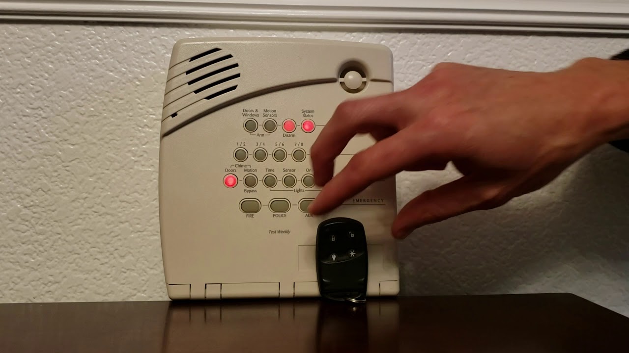 How to program a keyfob on a Simon 3 control panel - YouTube