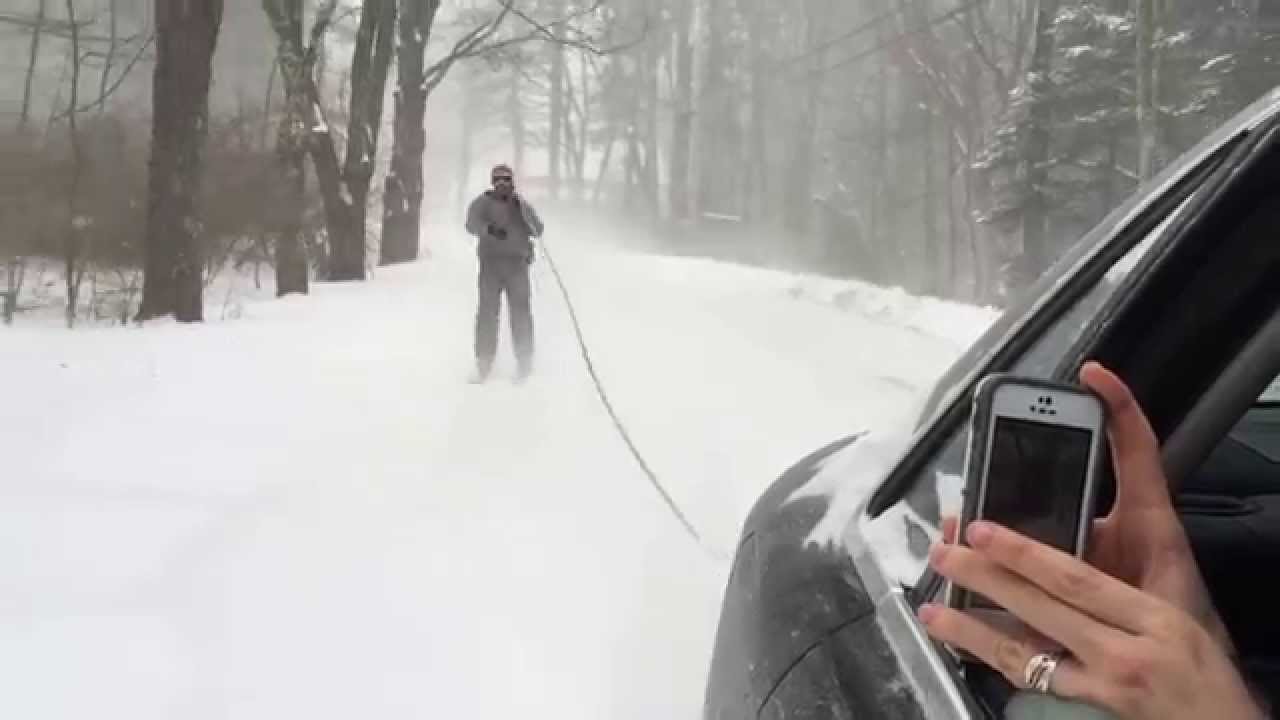 Skiing behind a car in a blizzard - YouTube