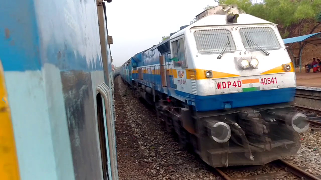 Dadar TEN speeds past 16338 Okha @ Kumta - YouTube