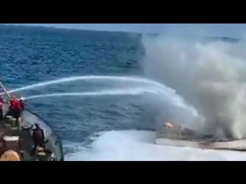 US Coast Guard tackle fire on fishing boat in dramatic video - YouTube