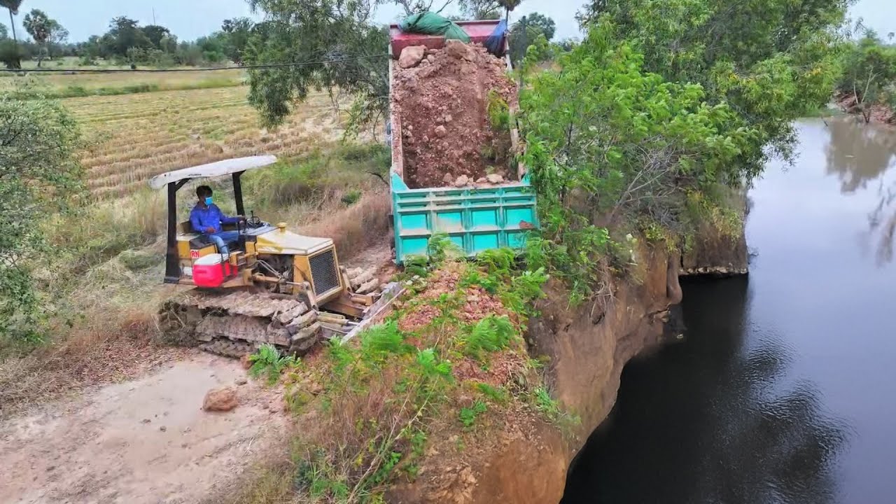 Landfill Project: Dump Truck Dumping Soil Connecting River with dirty ...