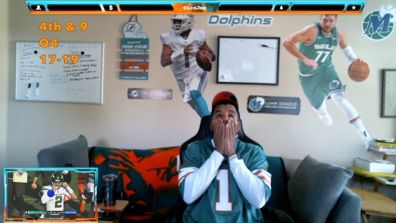 Dolphin fan cries while losing to Jets - YouTube