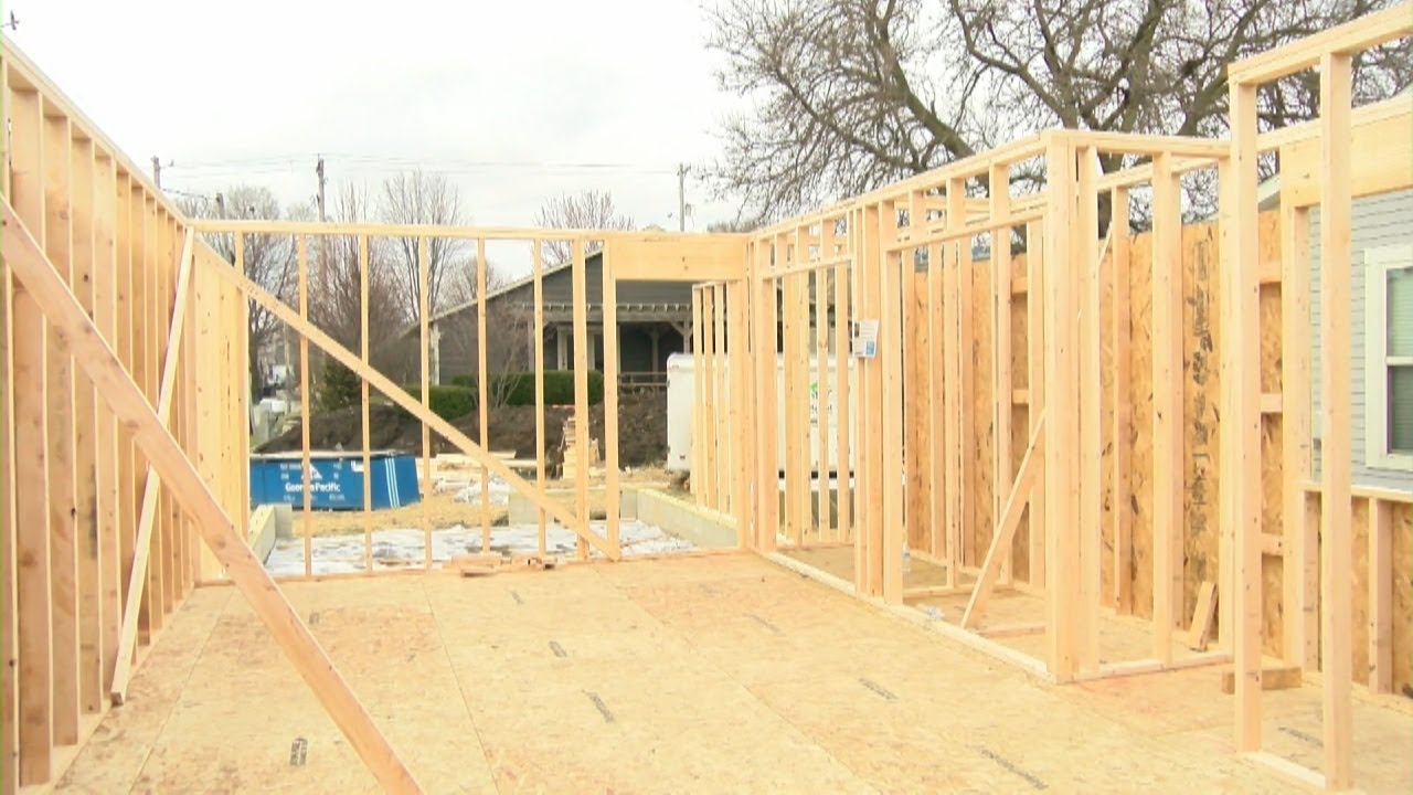 Central Catholic mother and son are all smiles during wall raising ...