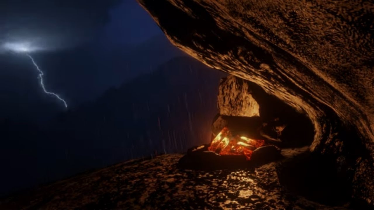 Sheltering from a thunderstorm with a campfire under overhanging rock ...