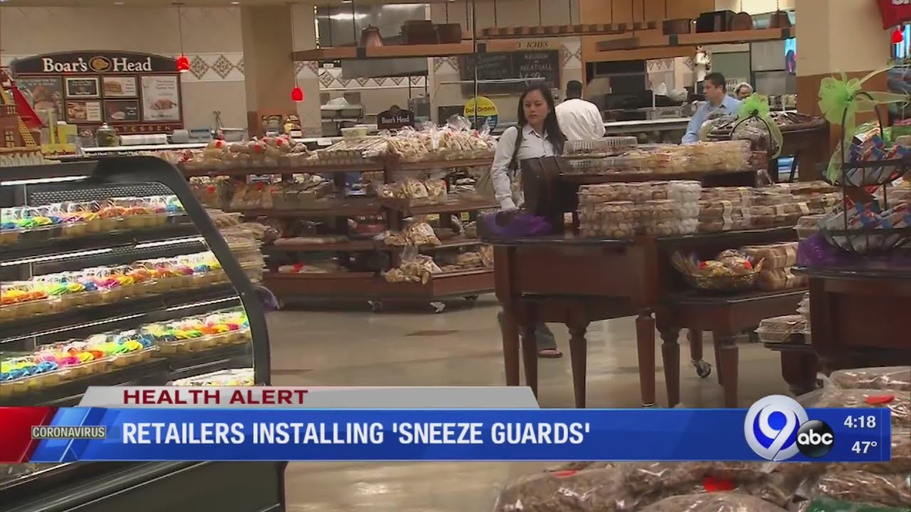 Retailers installing 'sneeze guards' - YouTube