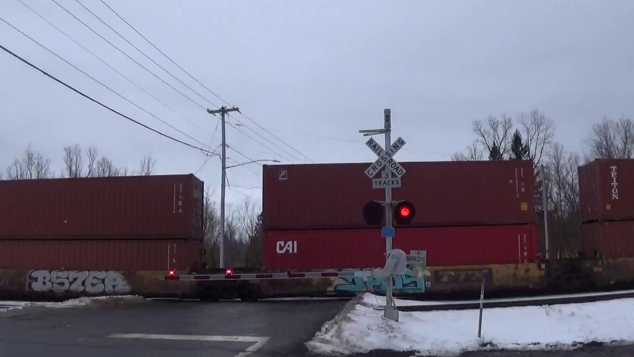 CSX train crosses railway crossing - YouTube
