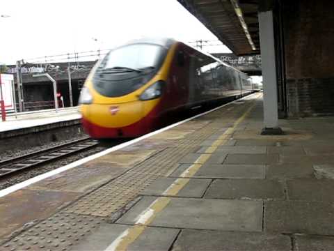 Virgin Trains Pendolino passes through at speed - YouTube