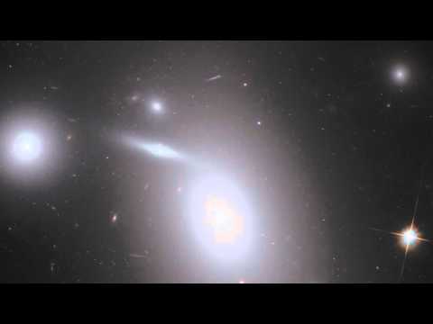 Panning across the elliptical galaxy NGC 4889 - YouTube