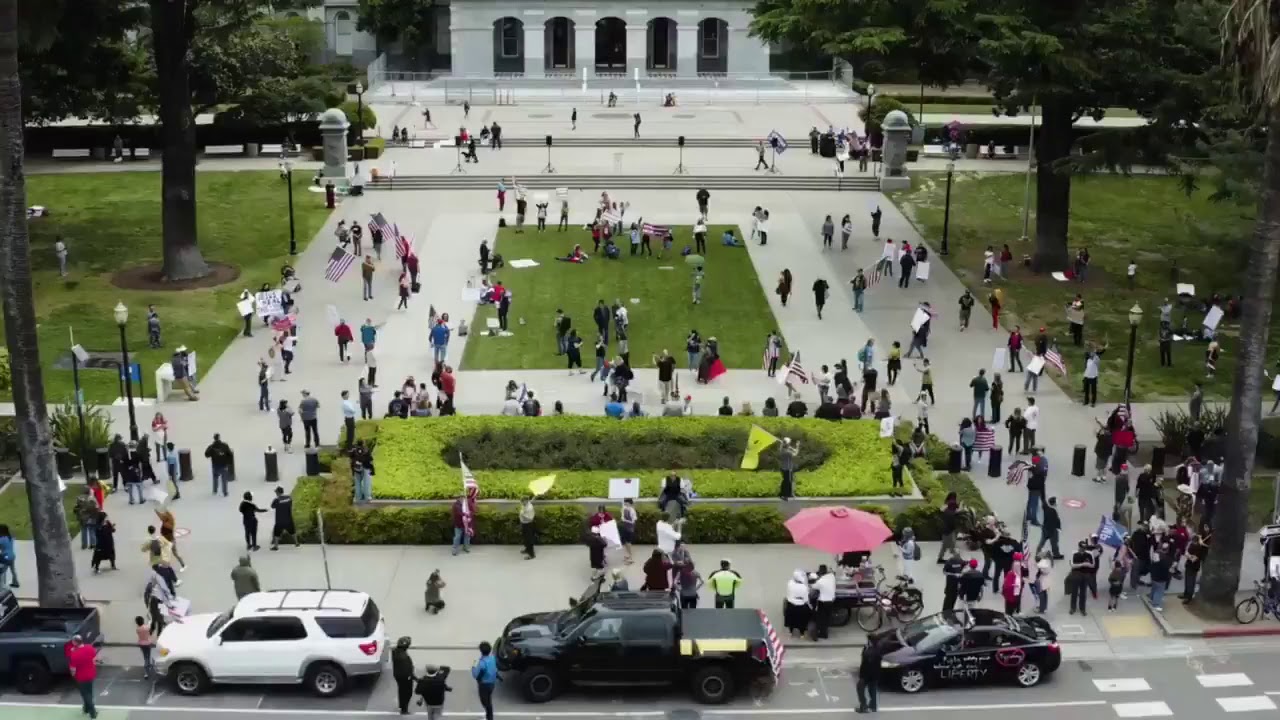 Drone video shows the crowd at the protest against California's stay ...