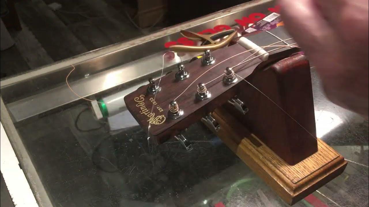 How to remove strings installed with a luthier's knot - YouTube