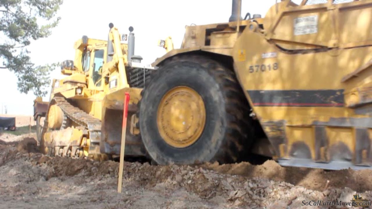 CAT D10N w/C27 pushing 657E 's - YouTube