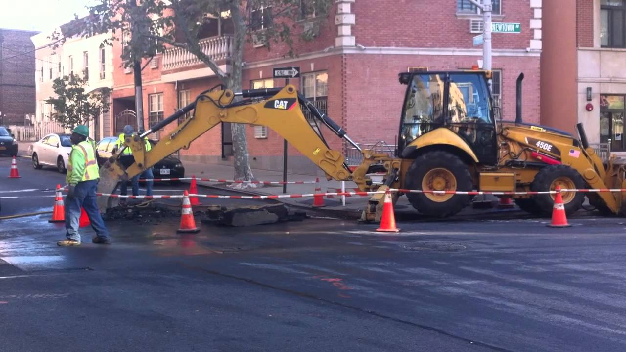 Excavator digging the pavement - YouTube