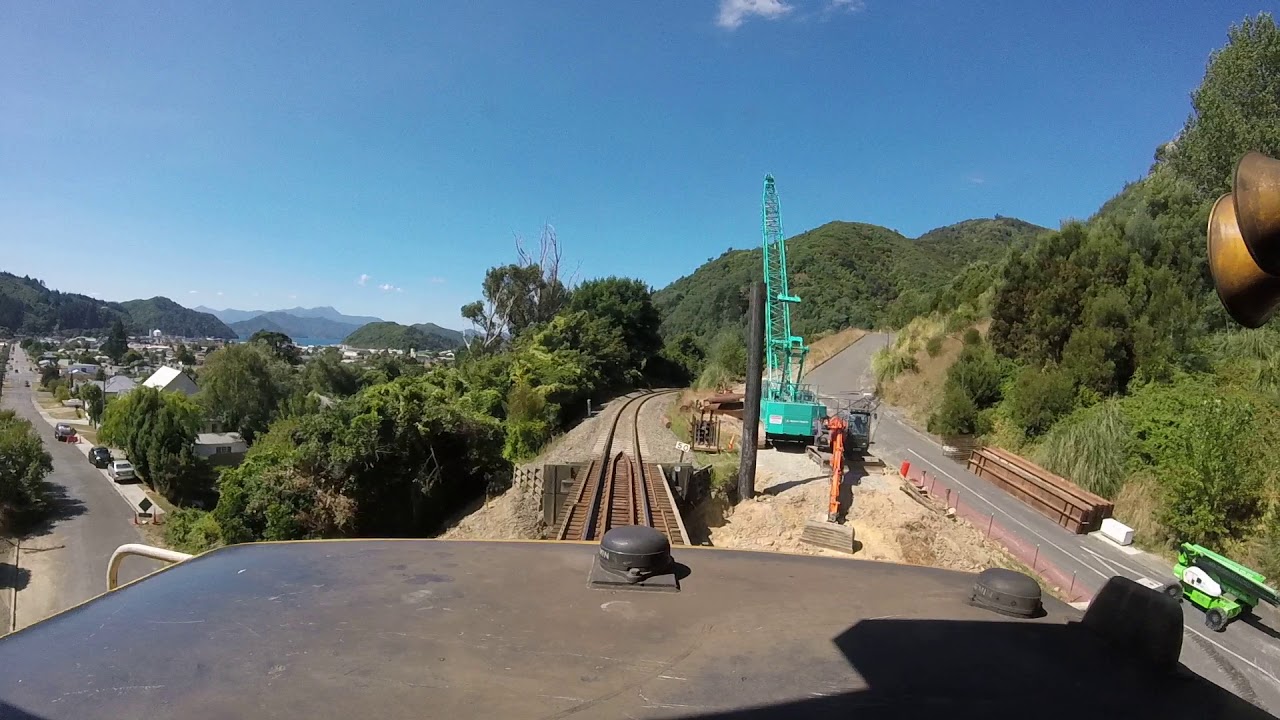 Locomotive cabride on a Freight train descending the elevation into ...
