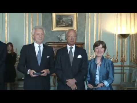 Professors Allen J Scott and Anne Buttimer receiving gold medals for ...