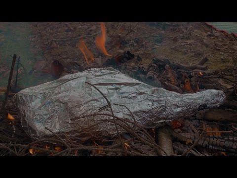 How to cook leg of lamb on a campfire - YouTube