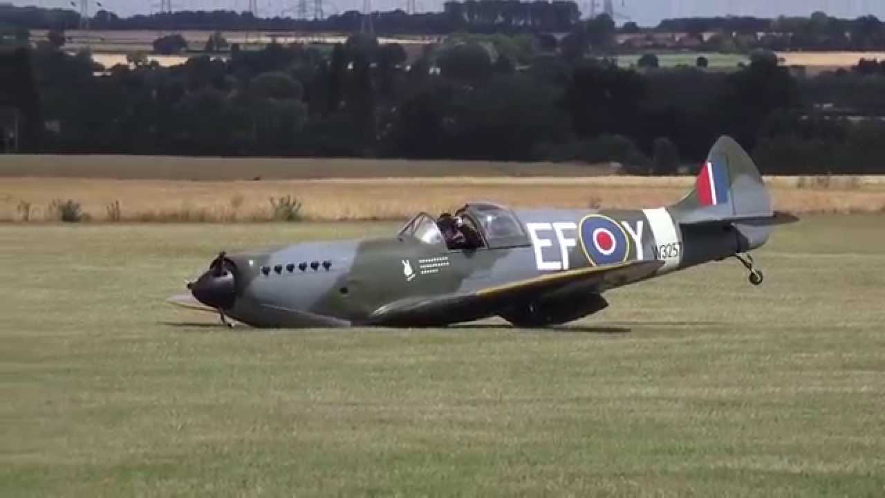 Dramatic moment a replica Spitfire lands without undercarriage - YouTube