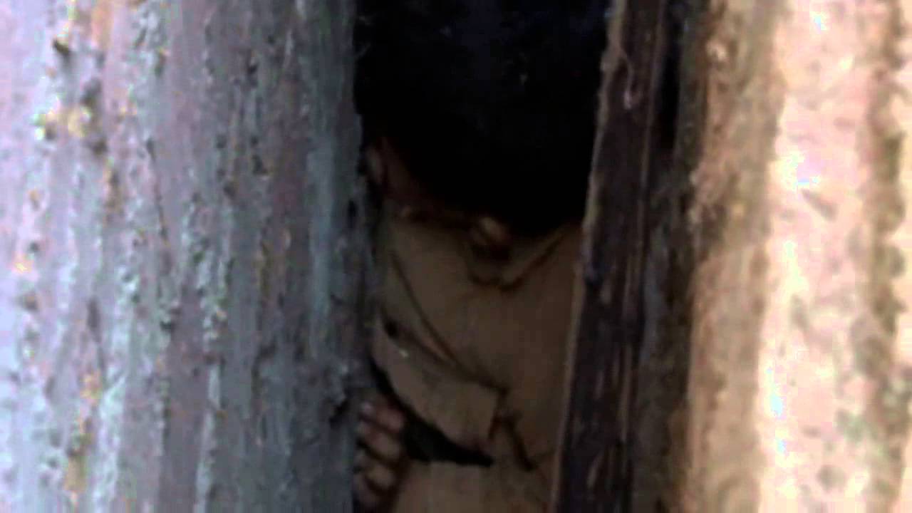 Chinese boy saved after falling off balcony and getting wedged between ...