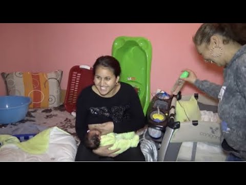 Relatives blessing baby | Breastfeeding