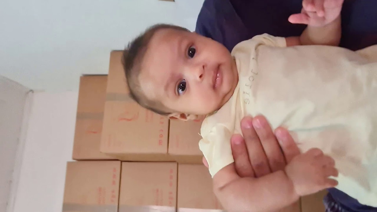 Cute newborn baby looking at the camera while recording video - YouTube
