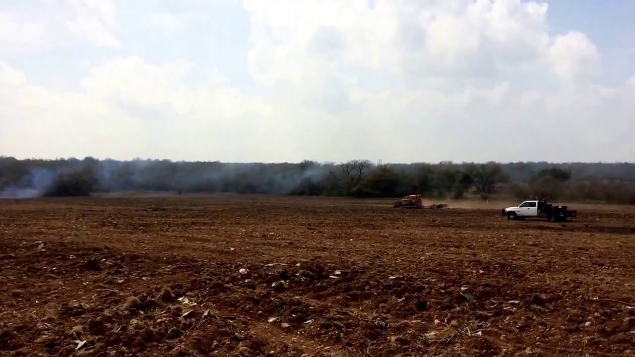 Root plowing Mesquite trees. Finish discing. - YouTube