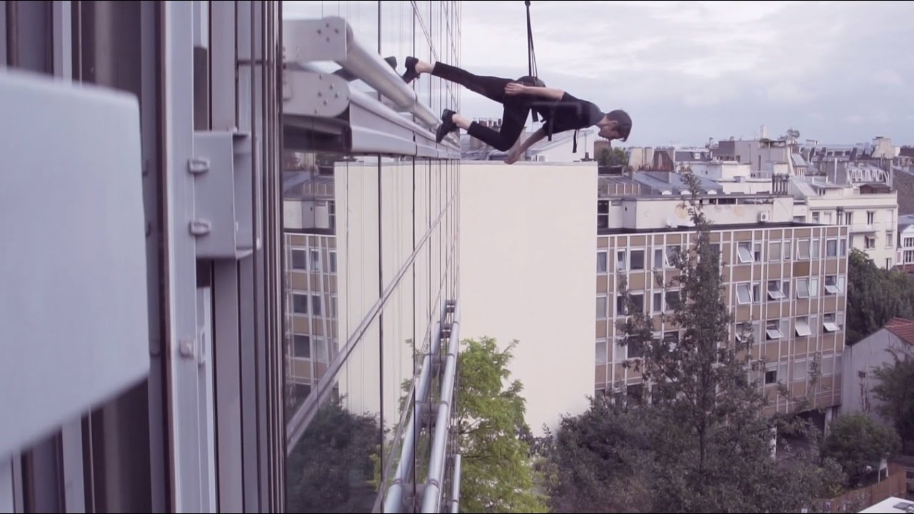 Man Walking Down the Side of a Building | Les Soirées Nomades ...