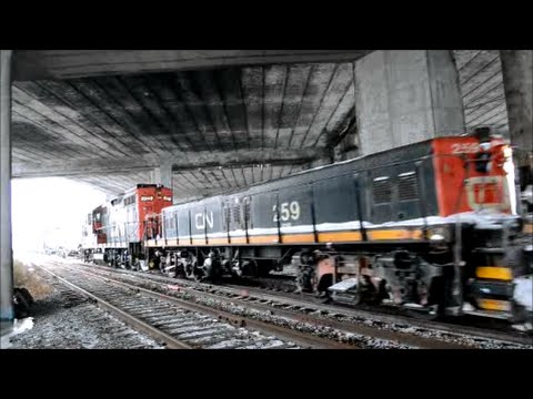 CN GP-9 LOCOMOTIVE & SLUG PASS UNDER HIGHWAY METROPOLITAN - YouTube
