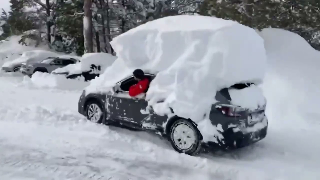 Guy Drives Car With Pile of Snow Accumulated Over its Top - 1279252 ...