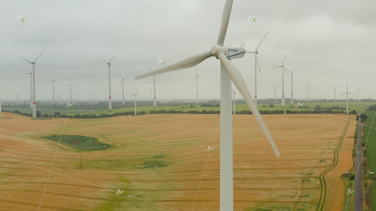 AERIAL: Wind Mill rotating by the force of the wind and generating ...