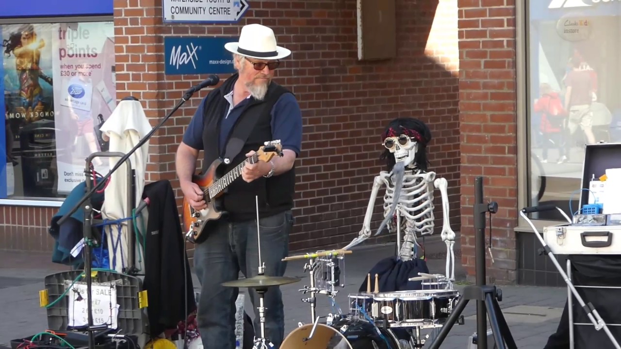 Busker with skeleton band - YouTube