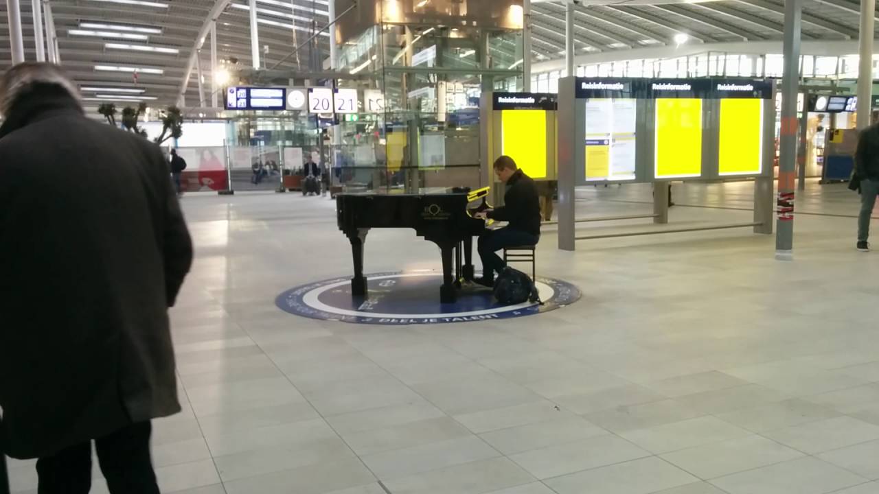 Man playing piano at train station - YouTube