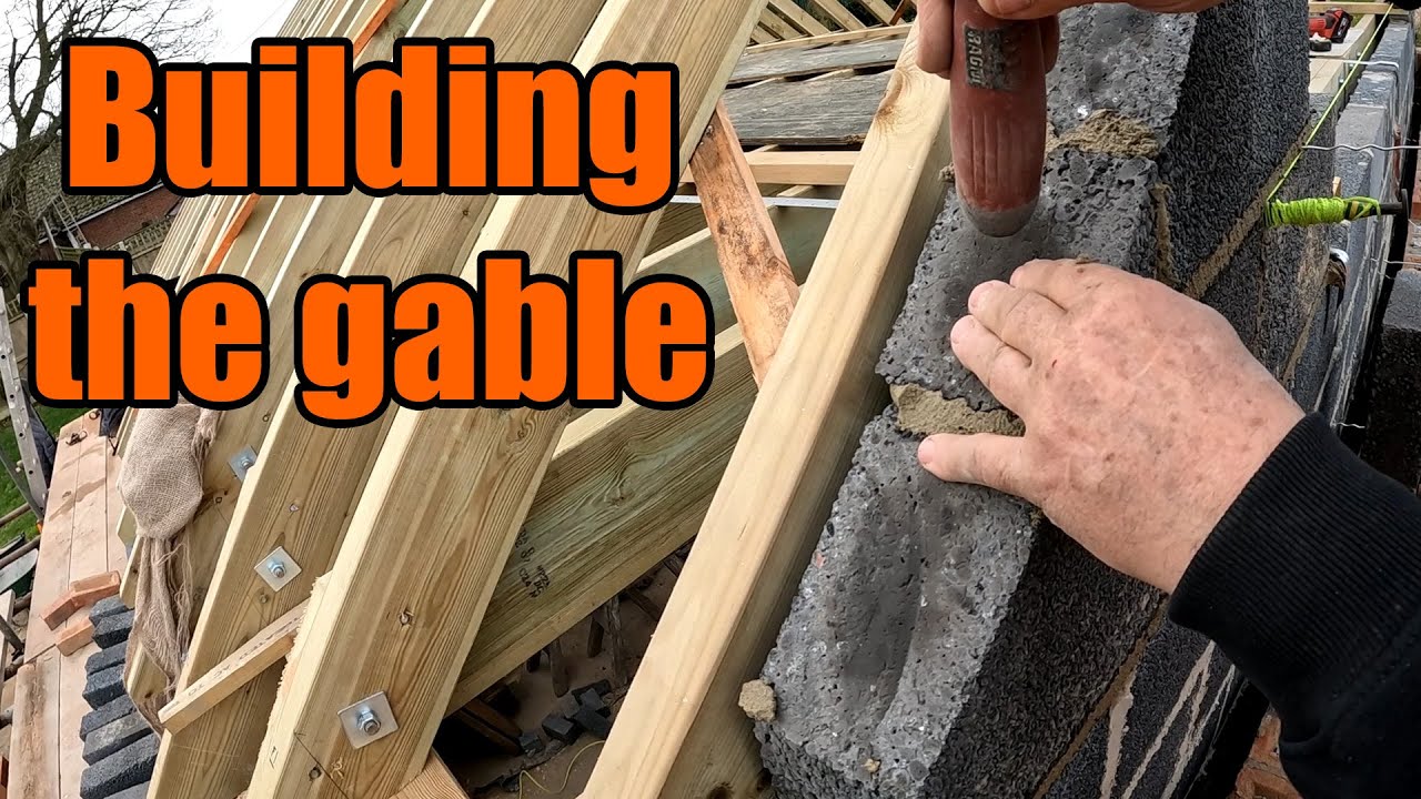 Laying blocks, building the gable - YouTube