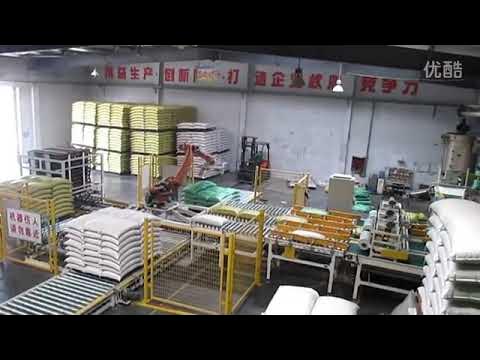 Kuka robot palletizer for feeder 25kg 50kg bag palletizing - YouTube