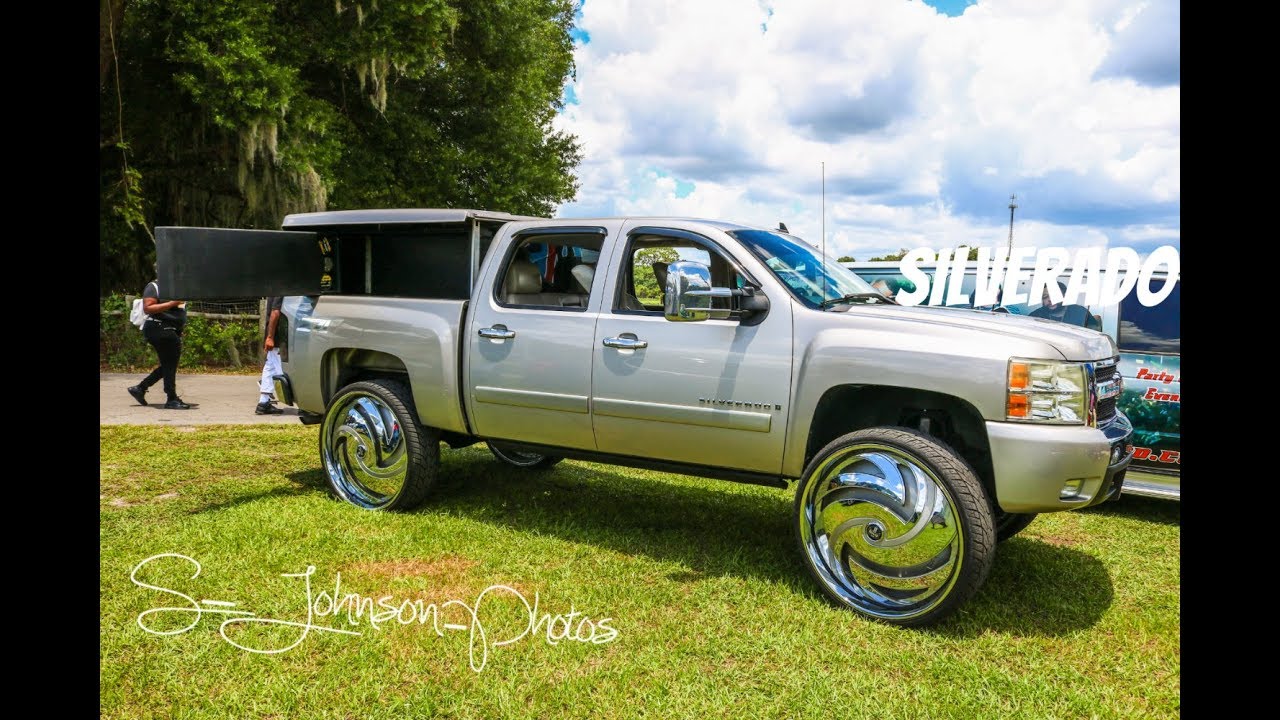 Chevy Silverado on Dub Wheels with speakers in the bed of the truck in ...