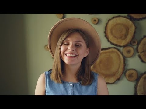 Pretty Blond Girl in Trendy Hat and Denim Top Looking at Camera, Smiling and Laughing | Stock