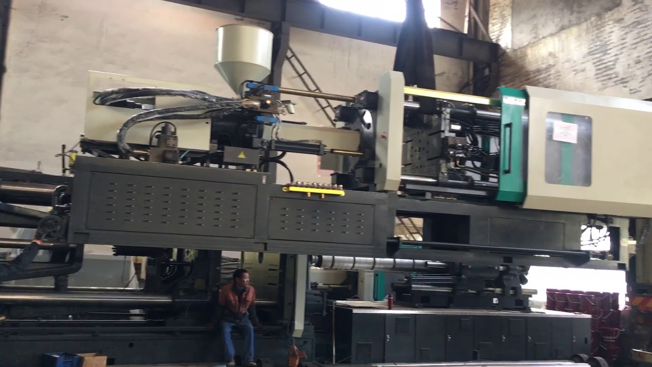 Loading injection molding machine 360 ton - YouTube