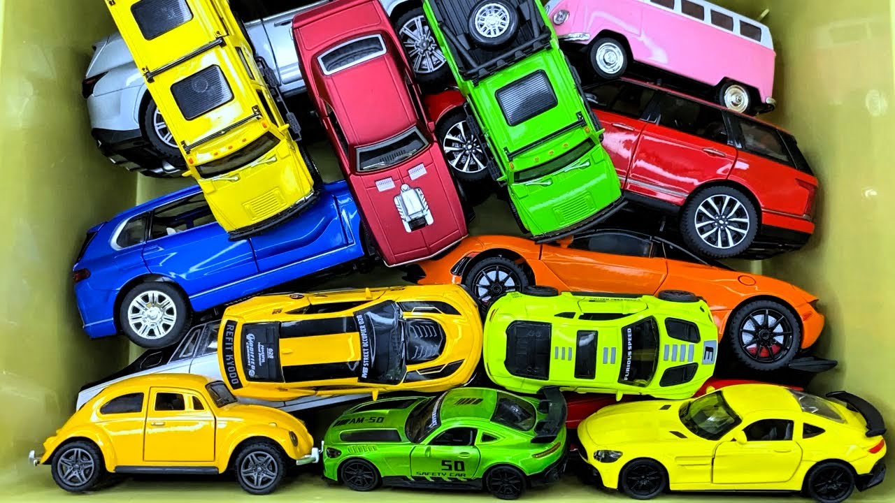 Box full of various miniature cars Peugeot, Volvo, Renault, Hyundai ...