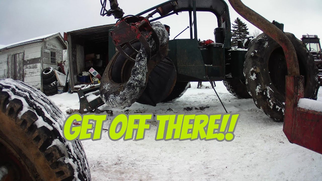 Changing A tire: Timberjack tire change skidder gets new "ER" pair of ...