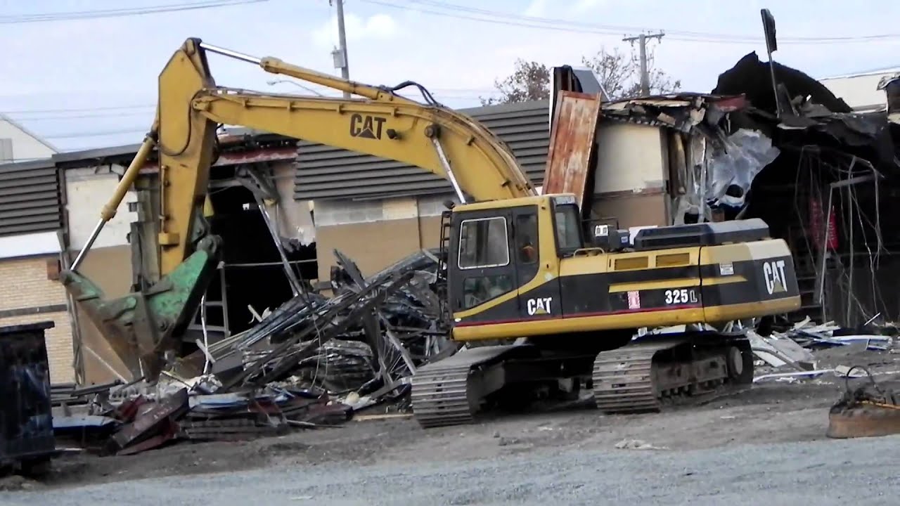 Cat 325L Shear In action - YouTube