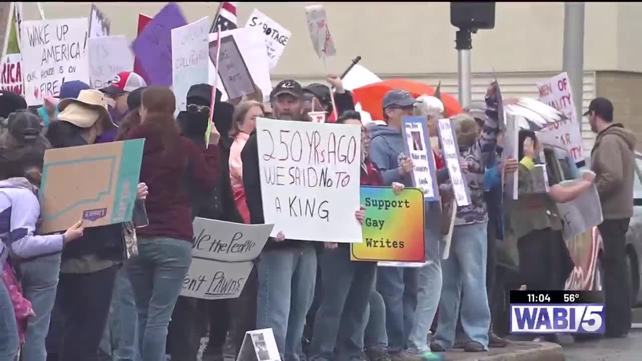 Indivisible Bangor holds protest outside of Bangor Federal Building ...
